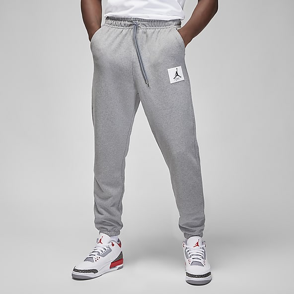 Muži Běžecké kalhoty a tepláky. Nike CZ