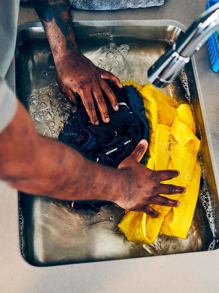 Man Washing Clothes By Hand
