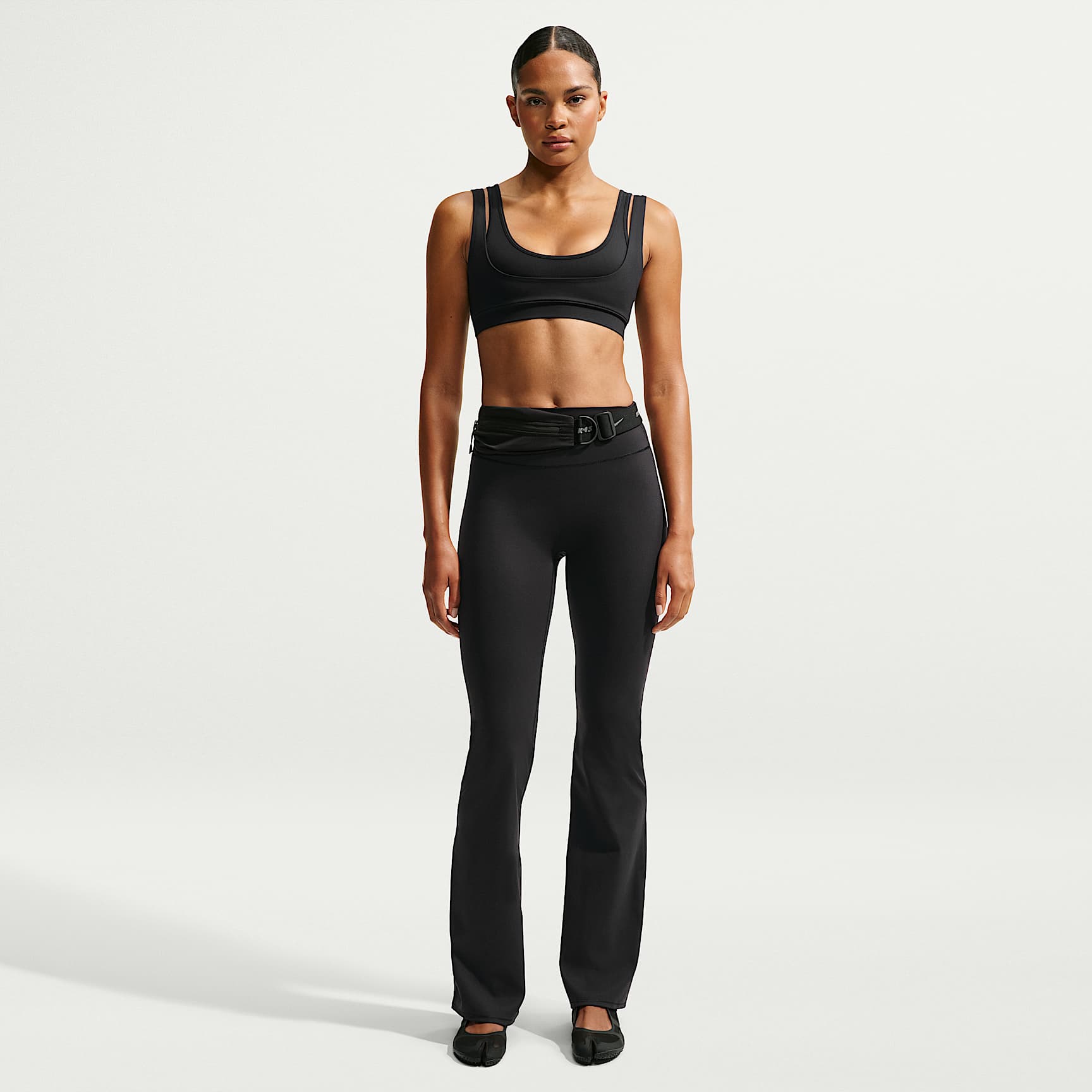 NikeSKIMS Matte Women's High-Waisted Slim Flared Leggings. Nike AT