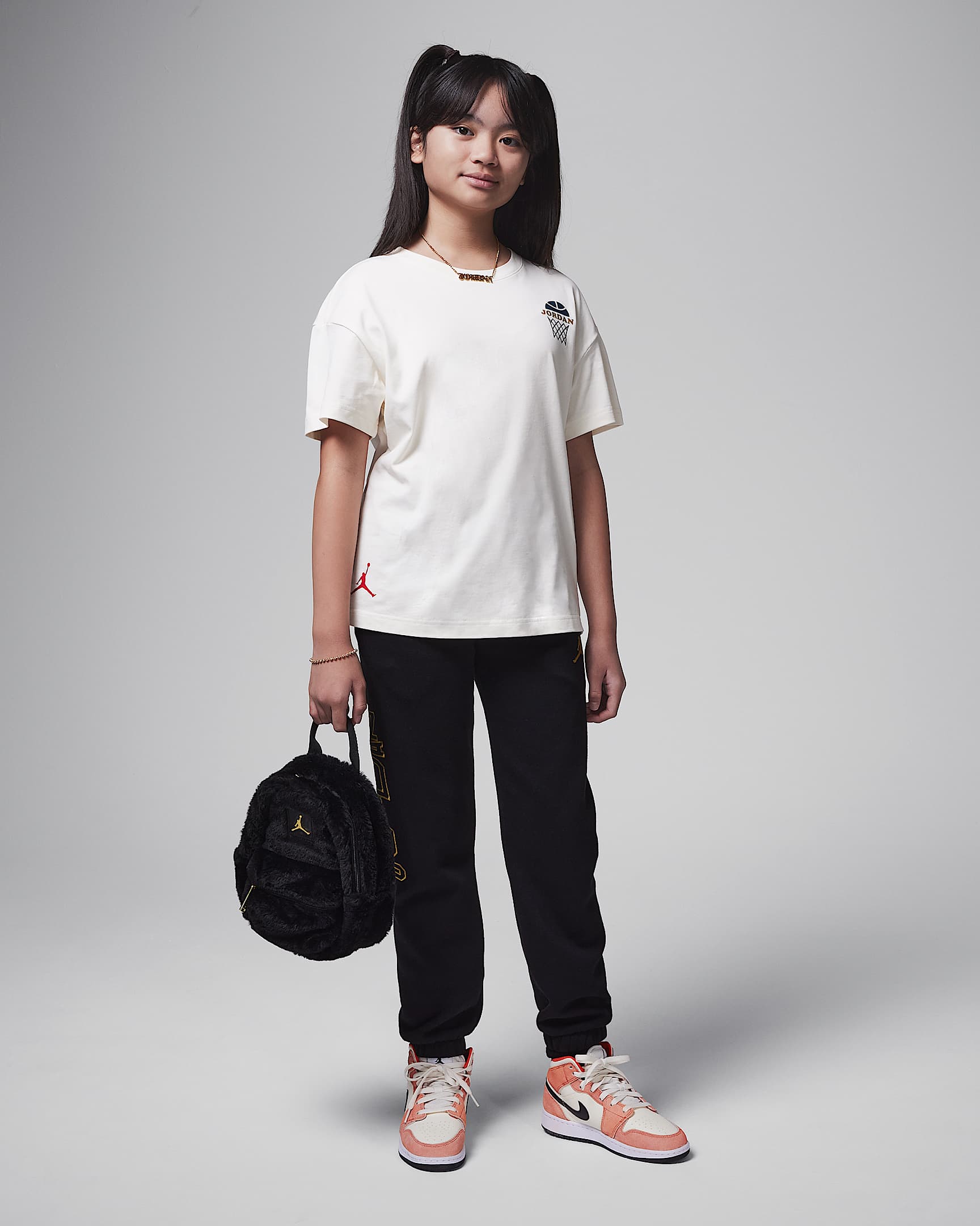 Jordan Big Kids' Faux Fur Mini Backpack (4L). Nike JP