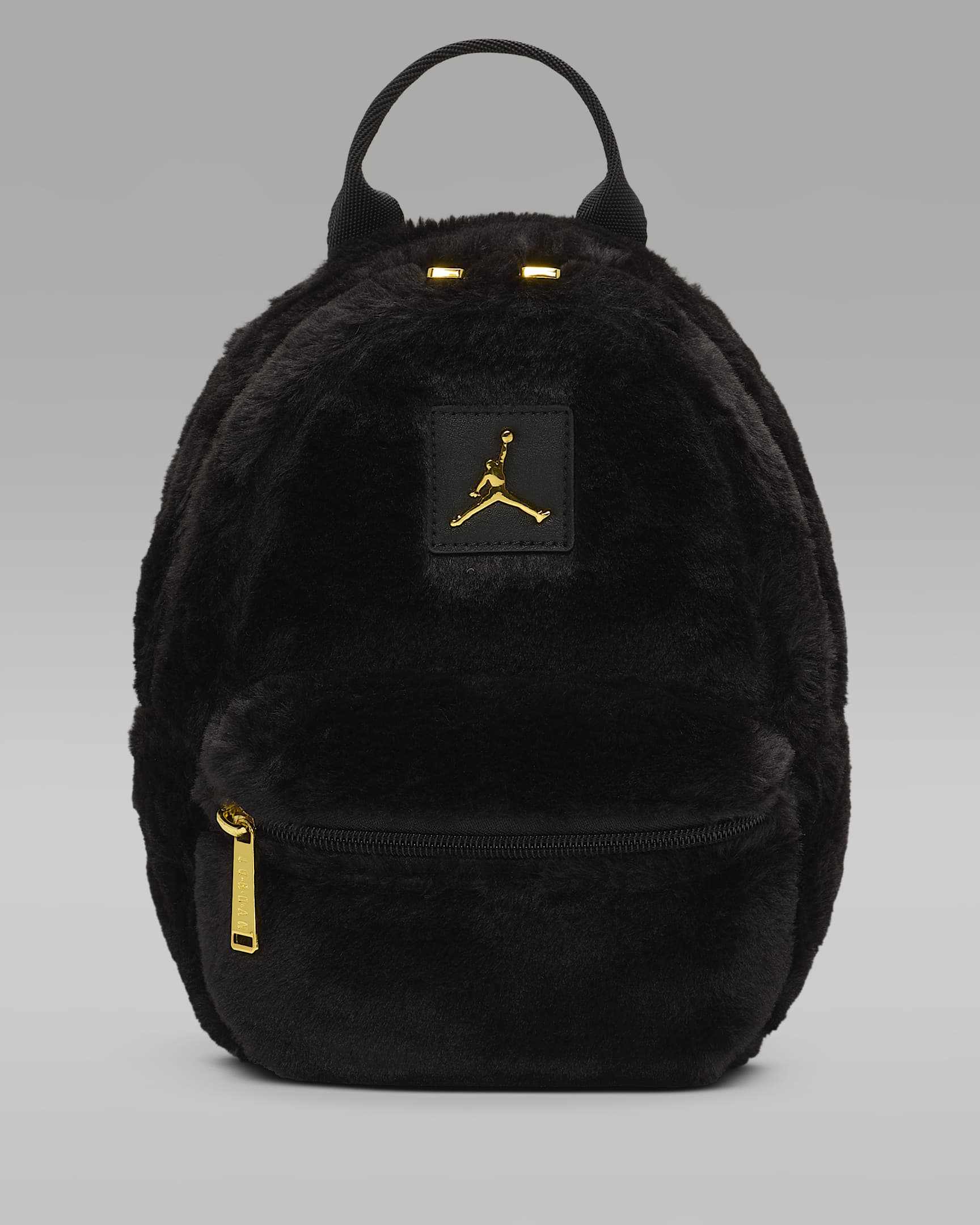 Jordan Big Kids' Faux Fur Mini Backpack (4L). Nike JP