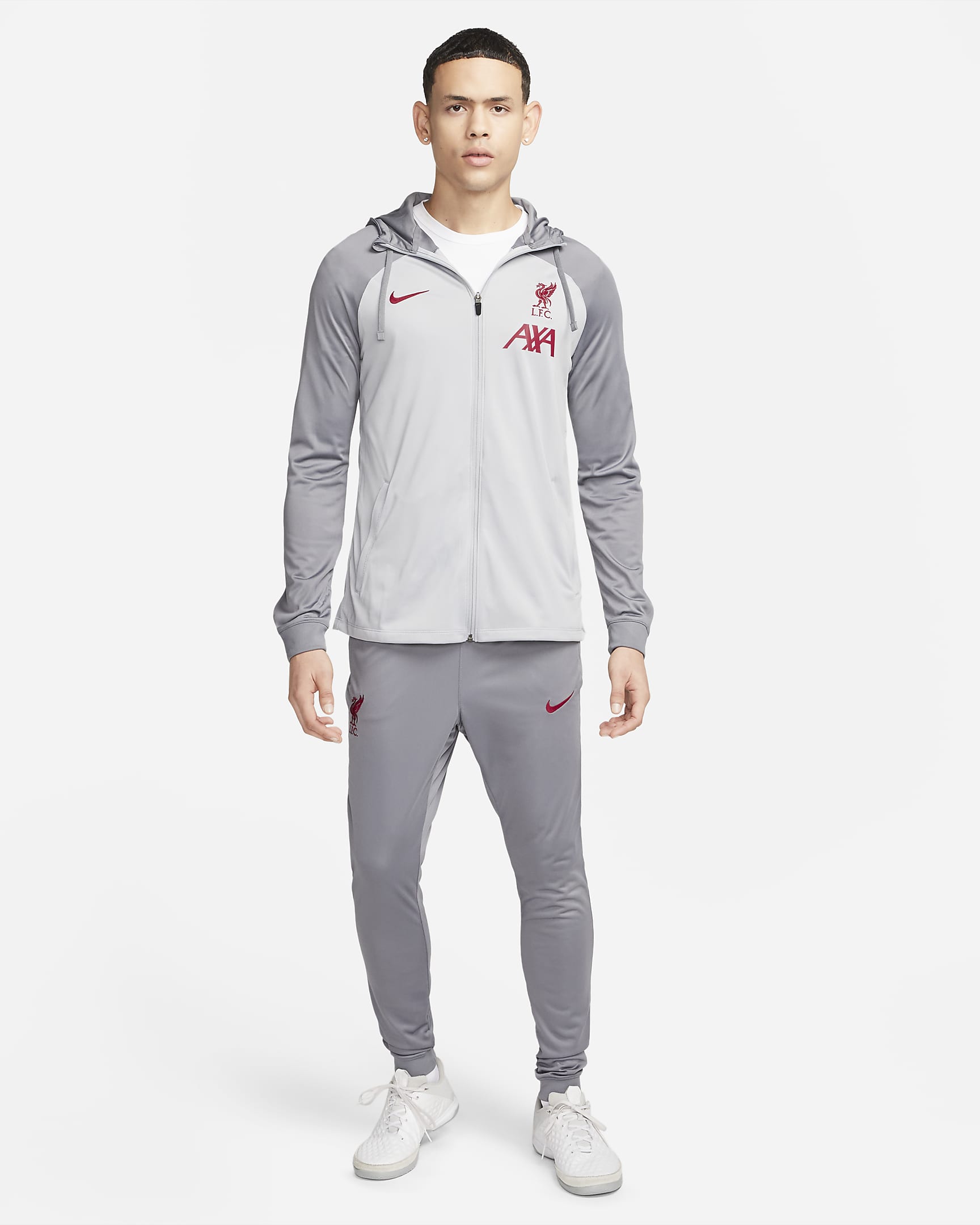 Liverpool F.C. Strike Men's Nike Dri-FIT Hooded Tracksuit. Nike SA
