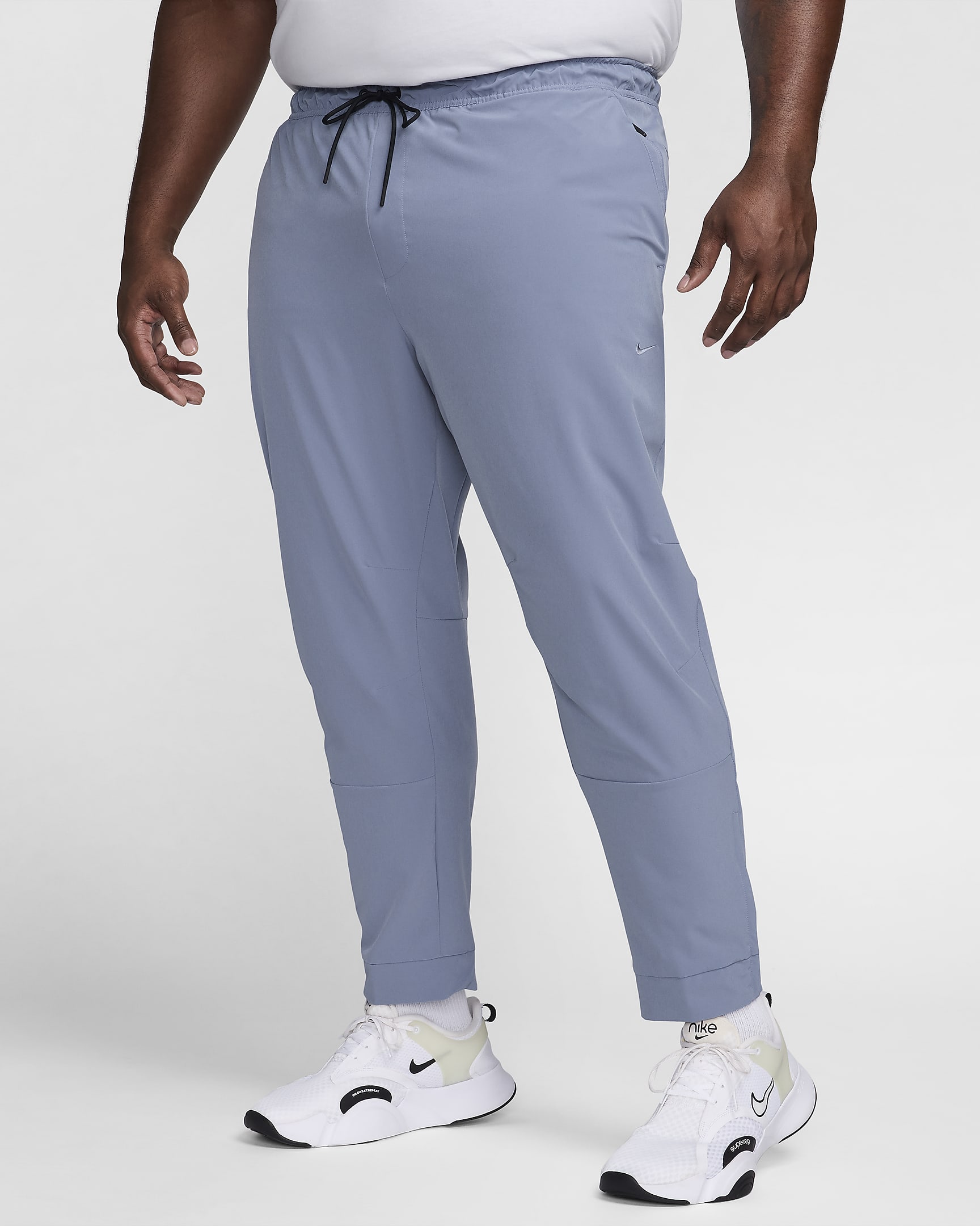 Pantalon avec ouvertures à zip Nike Dri-FIT Unlimited pour homme. Nike CA