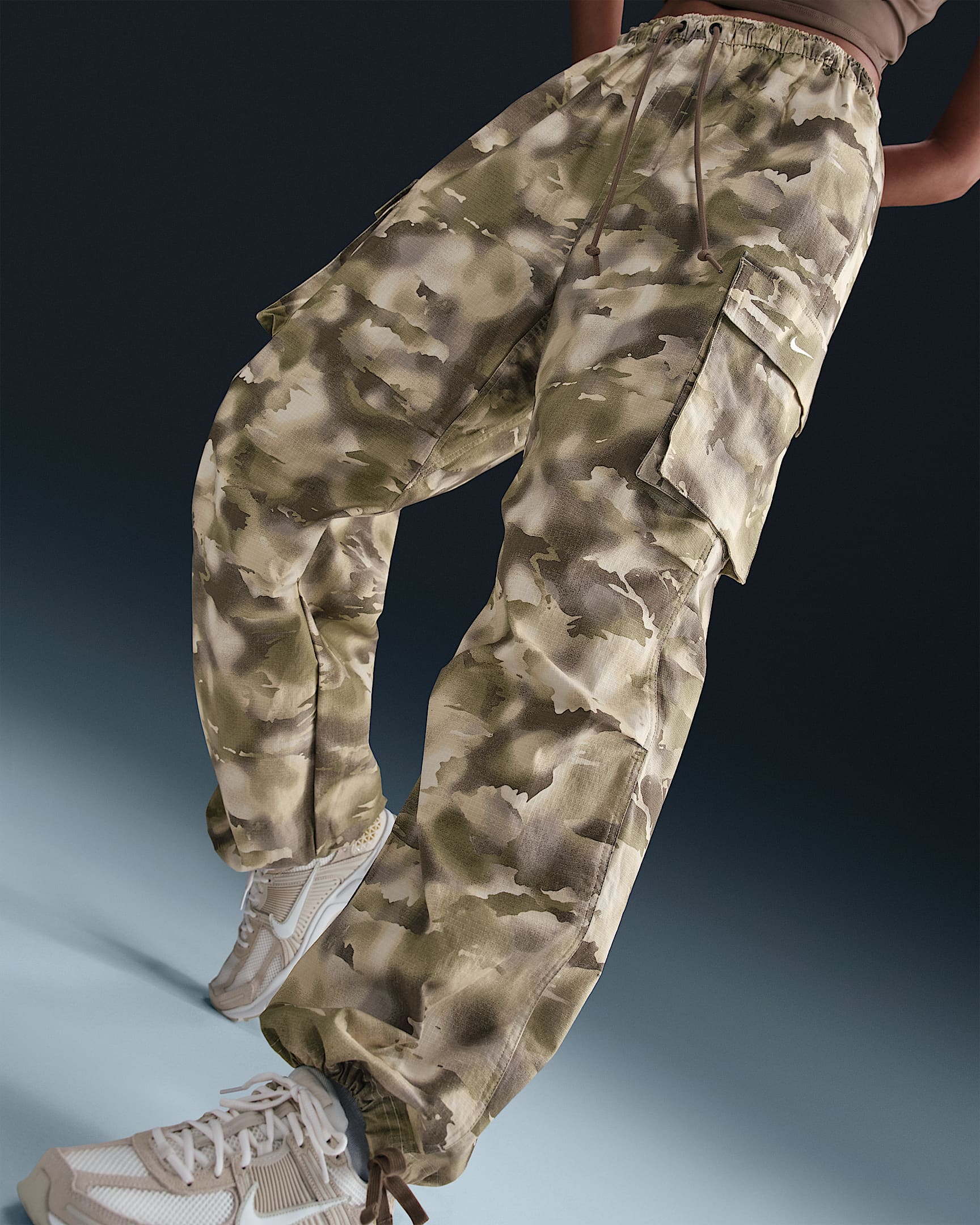 Nike Sportswear Women's Mid-Rise Oversized Camo Cargo Trousers. Nike CA