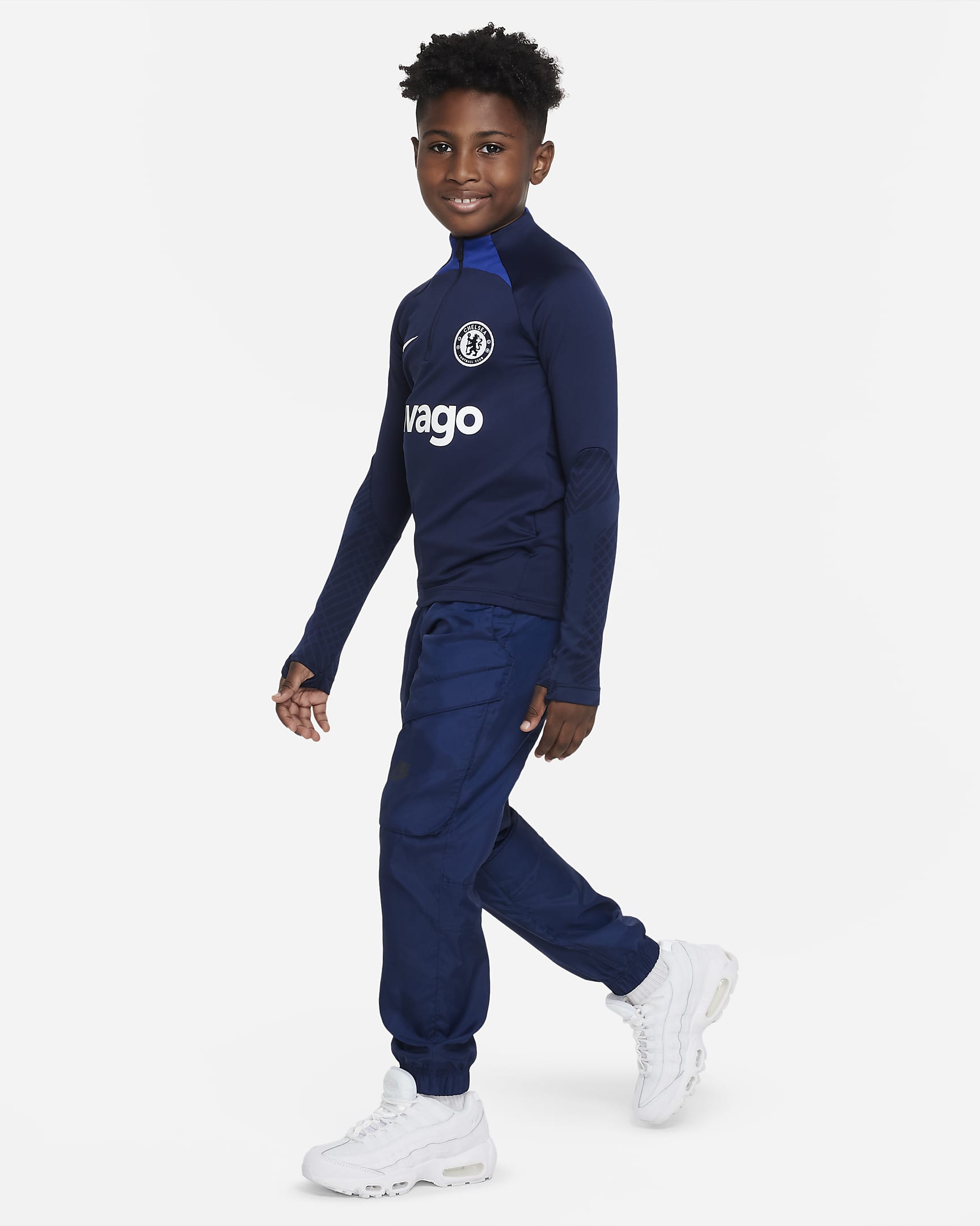 Chelsea F.C. Strike Older Kids' Nike Dri-FIT Football Drill Top. Nike GB