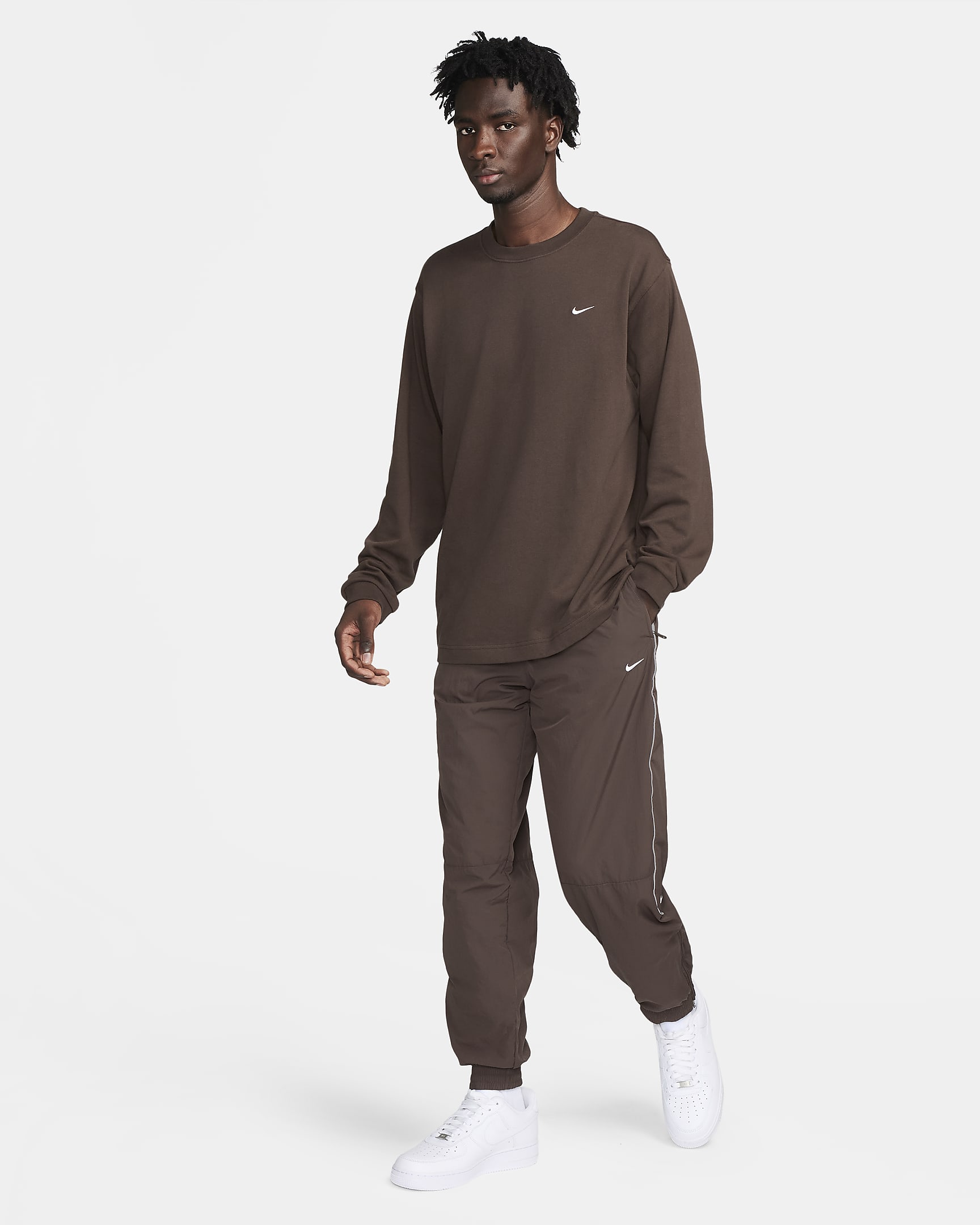 Trackpants Nike Solo Swoosh för män. Nike SE