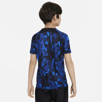 Chelsea F.C. Academy Pro Older Kids' Nike Dri-FIT Pre-Match Football Top. Nike LU